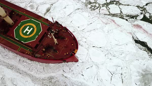 Drone top down Epic red steel icebreaker ship tanker breaks winter ...