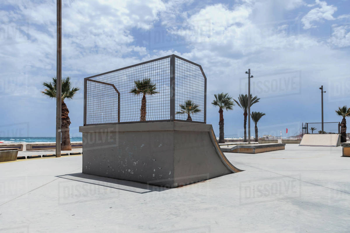 Empty skate park ramp outdoor in seaside beach - Stock Photo - Dissolve