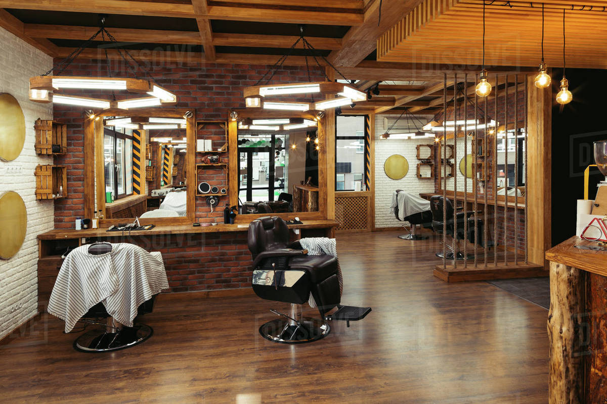 Modern stylish empty barber shop interior with mirrors - Royalty-free ...