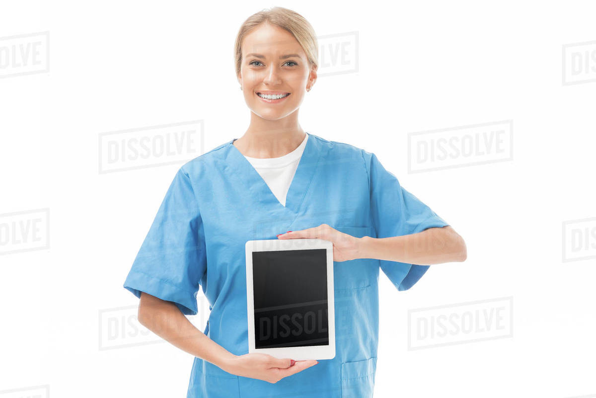 smiling young nurse holding tablet with blank screen isolated on white ...