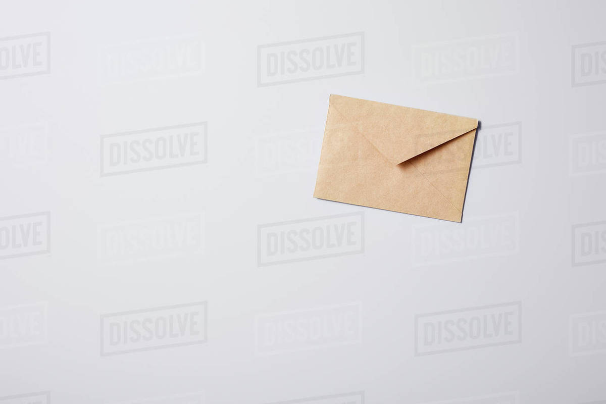 Top view of blank brown envelope on white surface for mockup - Royalty ...