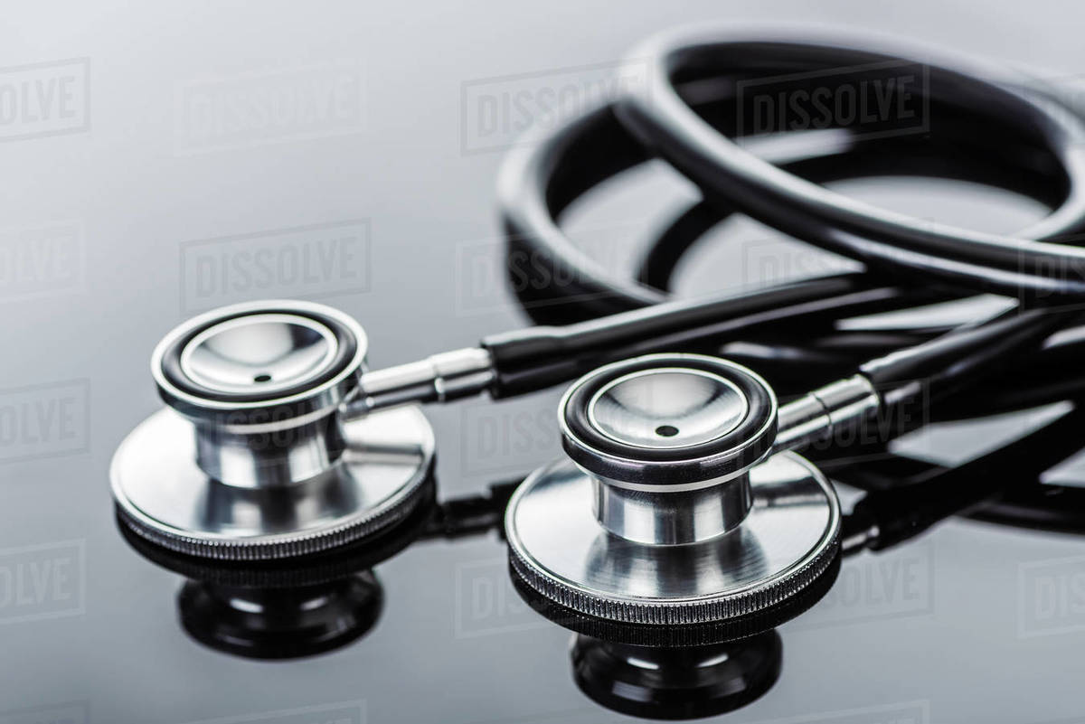 selective focus of two stethoscopes on glass surface - Royalty-free ...