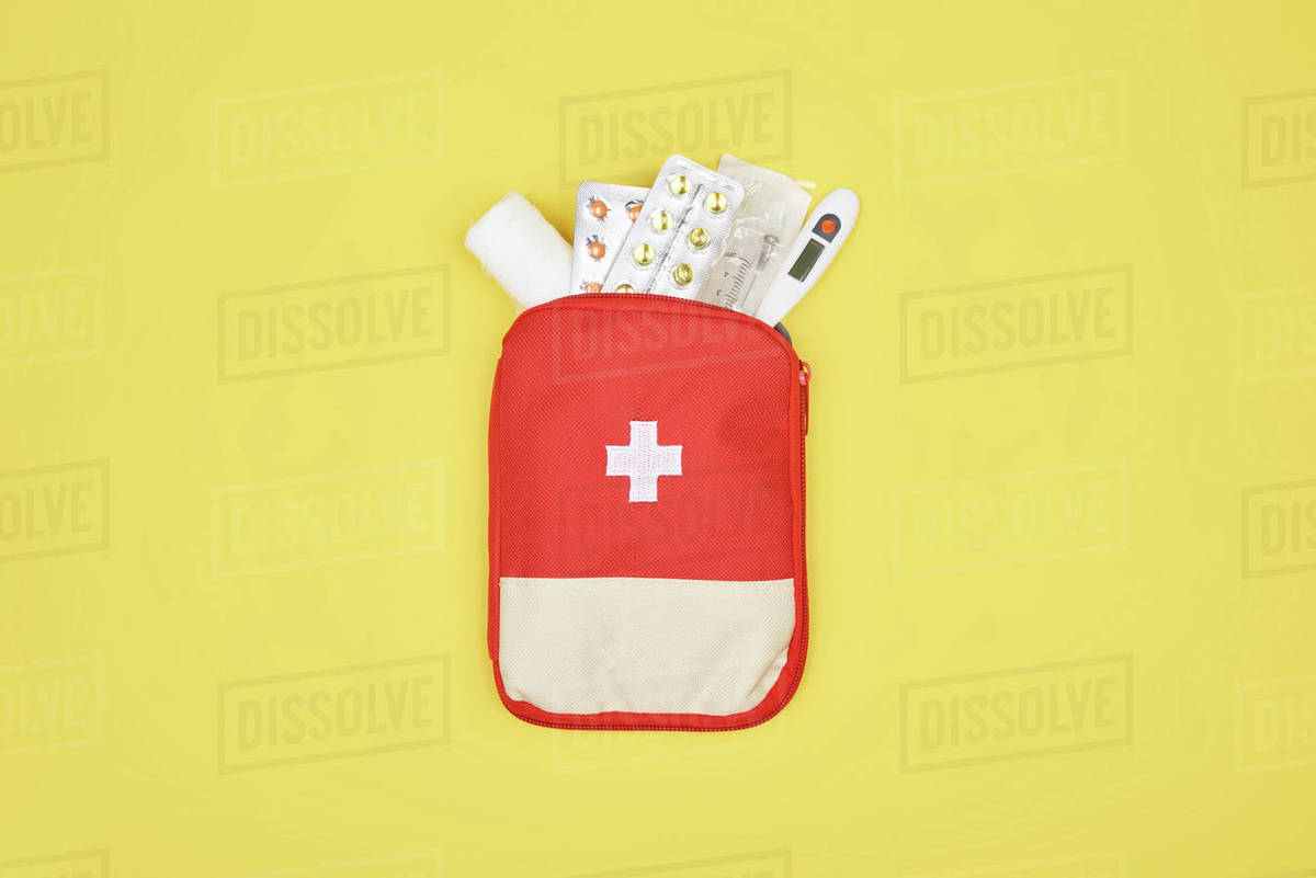 top view of automotive first aid kit with different medicines isolated ...