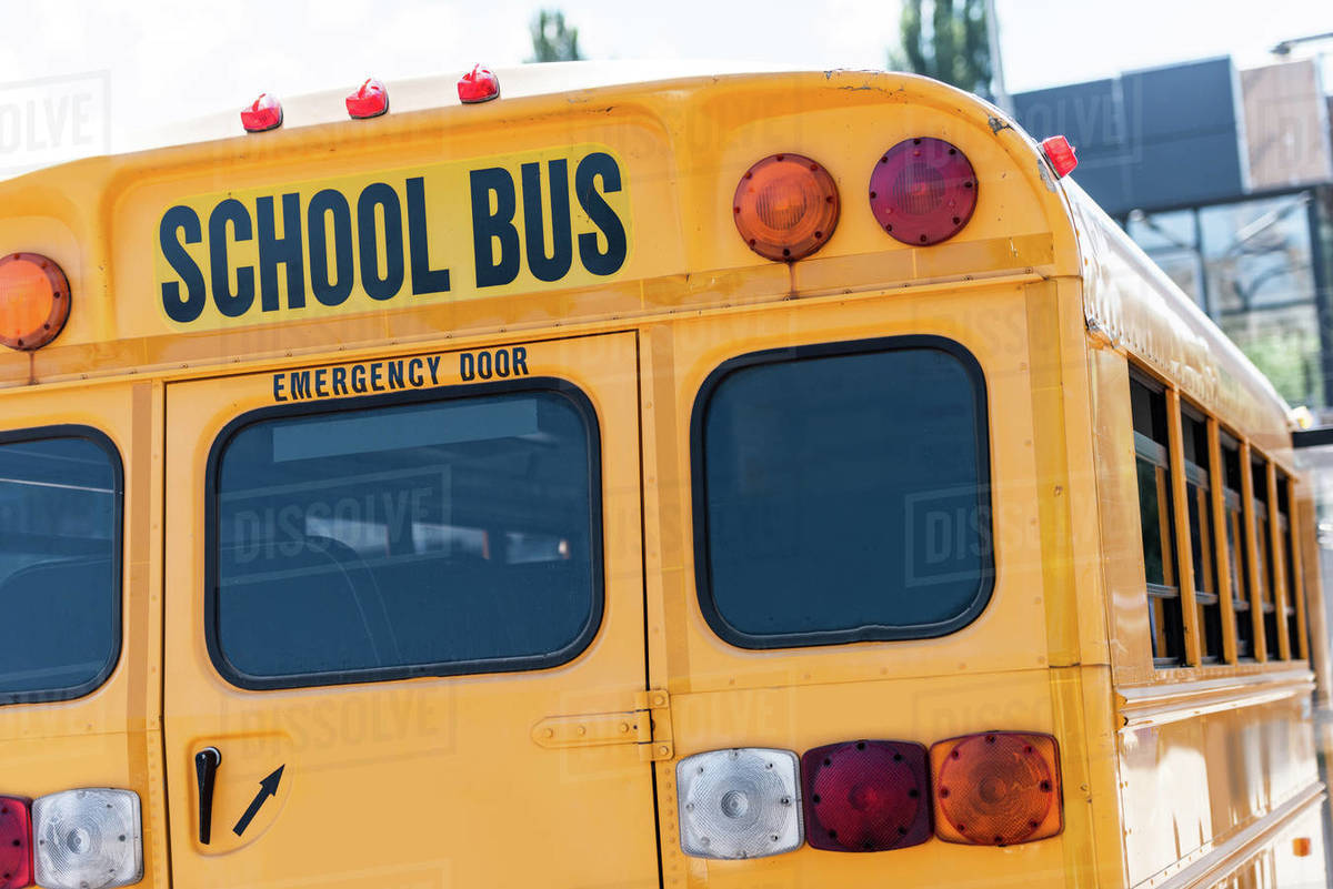 rear view of school bus with inscription over back door - Stock Photo ...