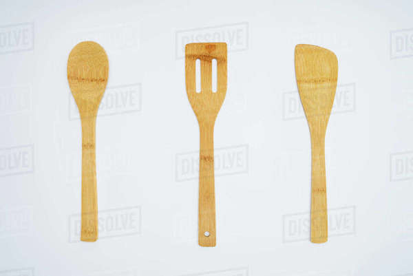 Top view of arranged wooden kitchen utensils isolated on grey - Royalty ...