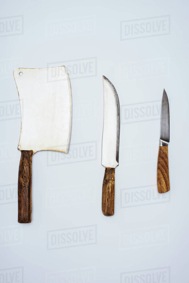 Top view of set of various kitchen knives isolated on grey - Royalty ...