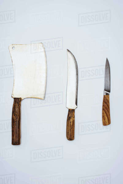 Top view of set of various kitchen knives isolated on grey - Royalty ...