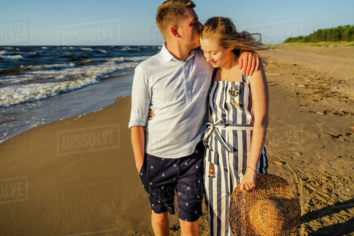 Young tender couple in love on sandy beach in Riga, Latvia - Stock ...