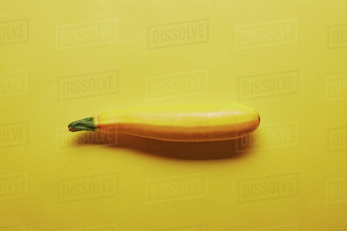 Raw squash vegetable on yellow background - Royalty-free Stock Photo ...