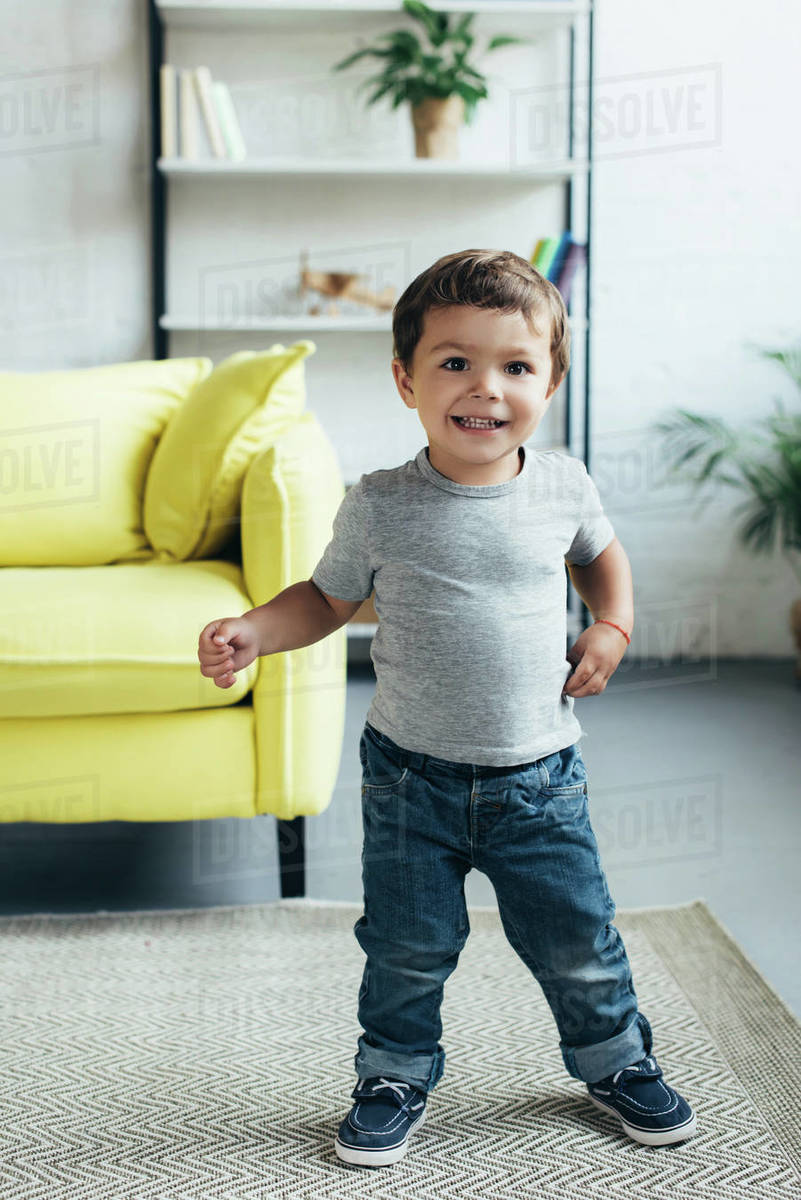 Happy cute child smiling at camera - Royalty-free Stock Photo | Dissolve