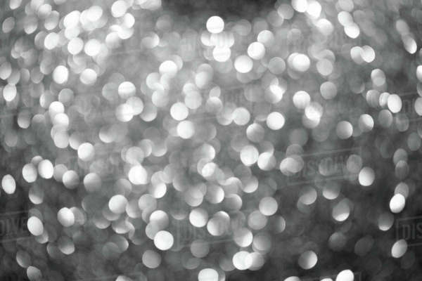 Abstract shiny blurred silver glowing background - Stock Photo - Dissolve