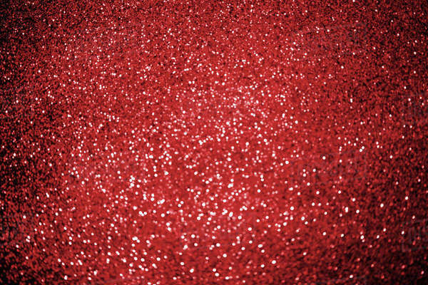 Abstract background with shiny red glitter decor - Stock Photo - Dissolve