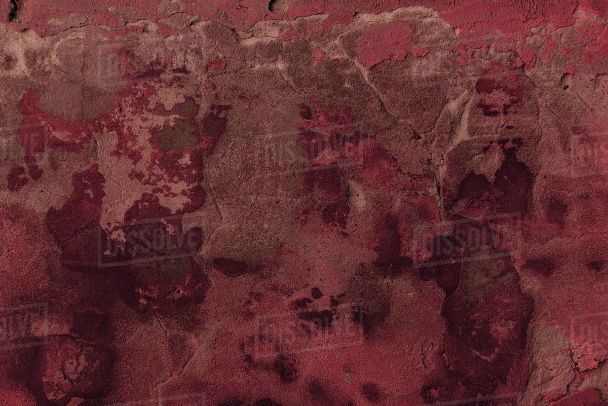 Full frame view of dark red cracked wall textured background - Royalty ...