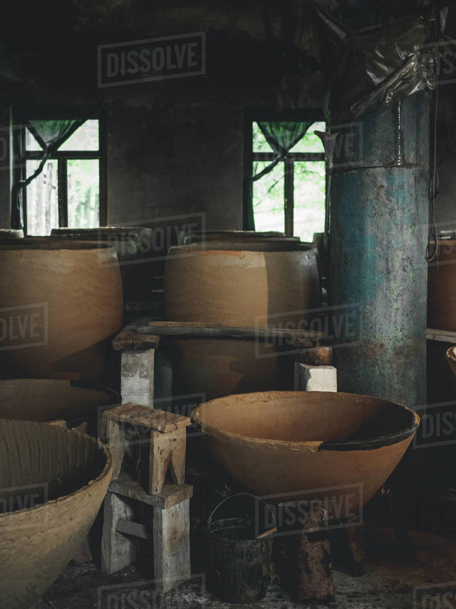 Big clay cisterns for producing wine in workshop in georgia - Royalty ...