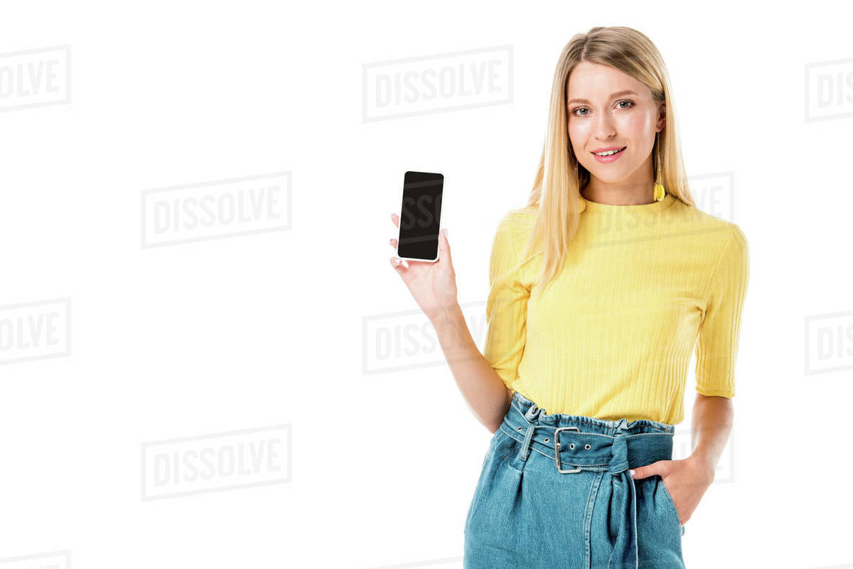 Beautiful young woman holding smartphone with blank screen and smiling ...