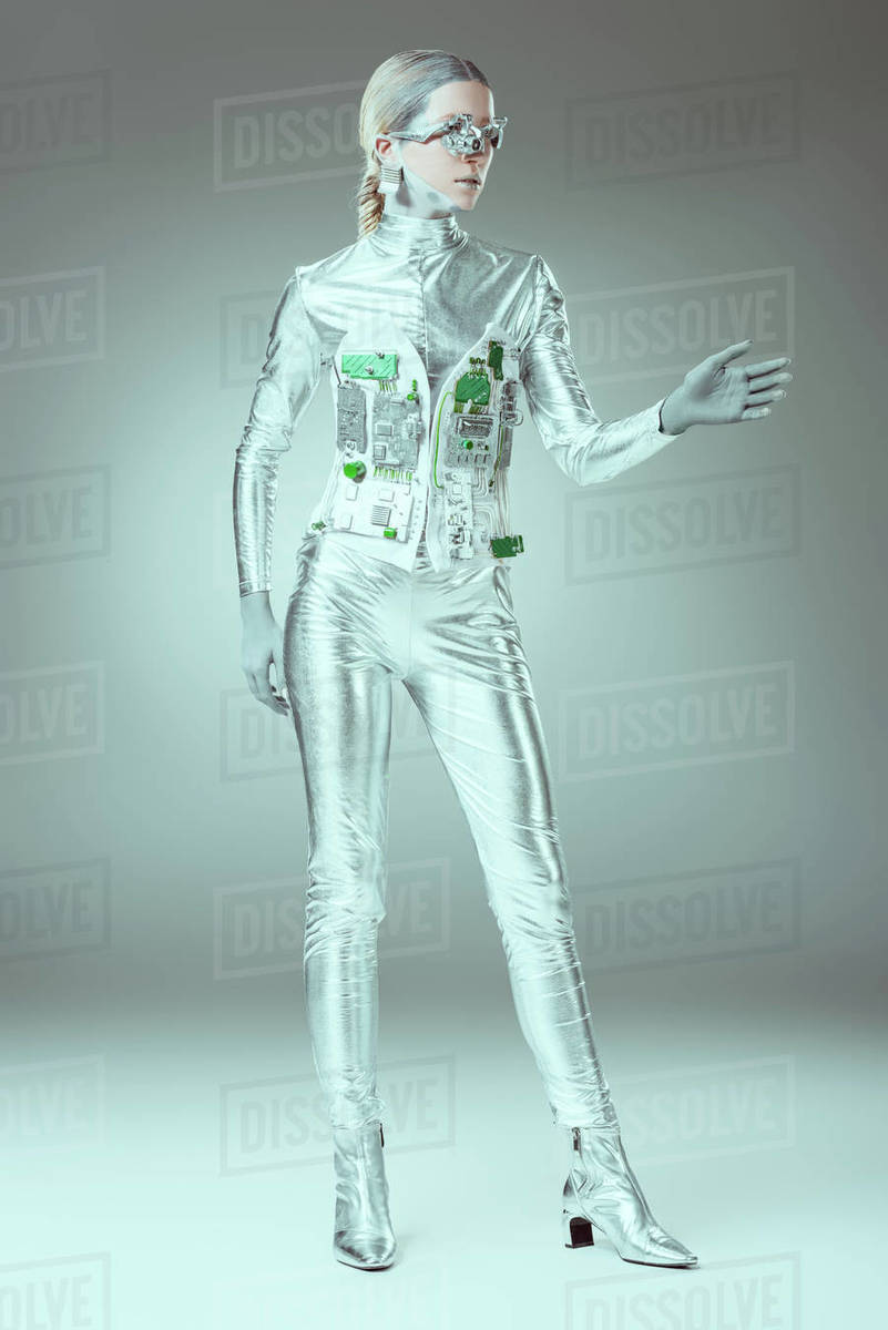 Full length view of silver woman robot standing on grey, future ...