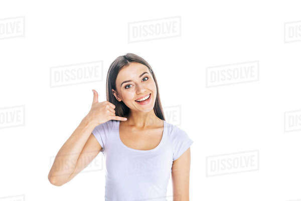 Portrait of smiling woman showing call sign isolated on white - Royalty ...