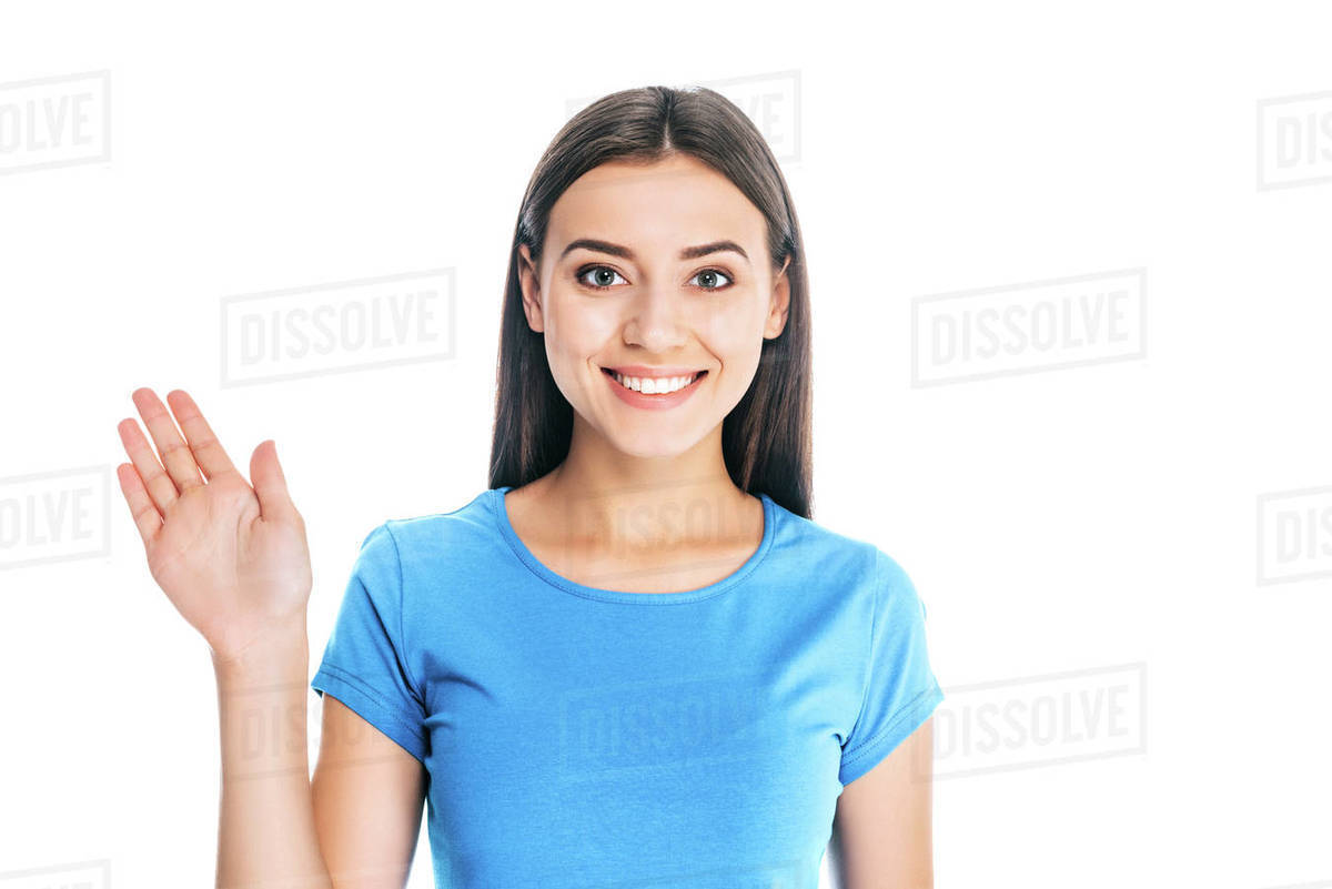 Portrait of attractive positive woman waving to camera isolated on ...