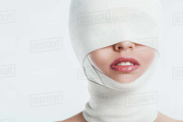 Close up of woman face with white bandages isolated on white - Royalty ...