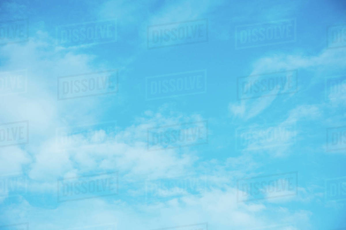 Beautiful light blue cloudy sky - Stock Photo - Dissolve