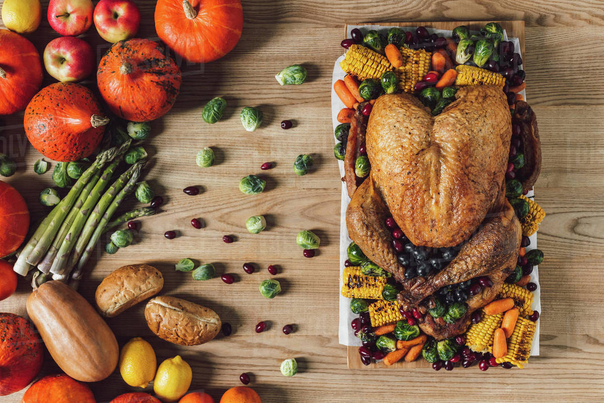 Top view of roasted turkey and vegetables for thanksgiving traditional ...