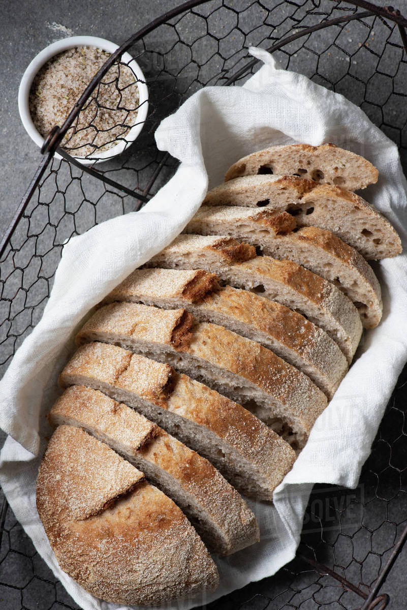 Flat lay with cut loaf of bread on grey tabletop - Royalty-free Stock ...