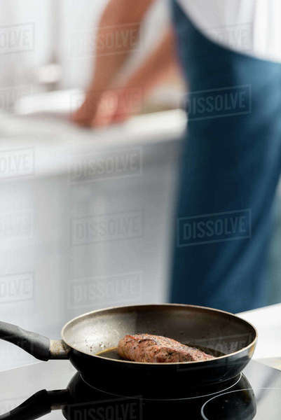 Close up view of steak on pan with blurred background - Stock Photo ...