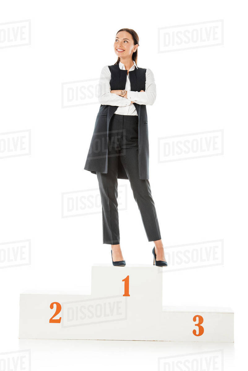 business winner with crossed arms standing on winners podium isolated ...