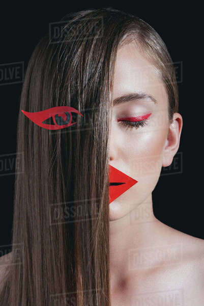 obscured view of woman with long hair and bright paper makeup posing ...