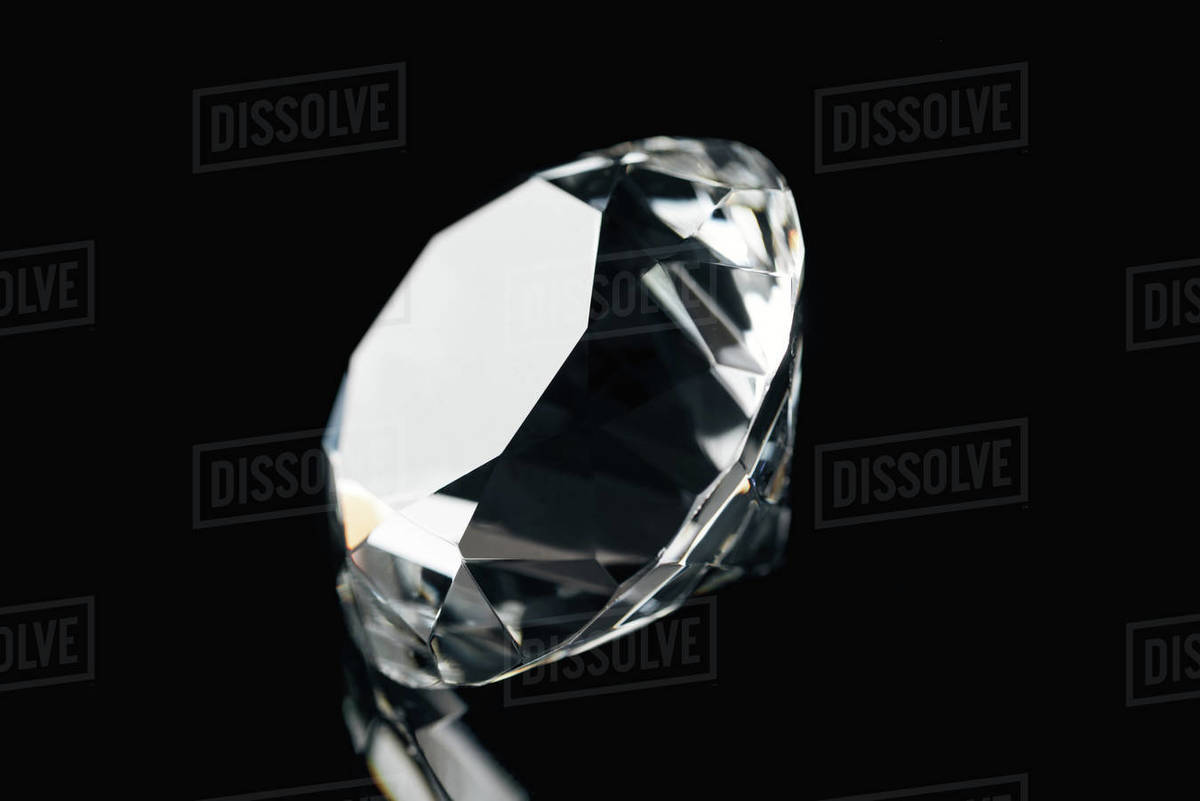 Pure shiny diamond isolated on black - Royalty-free Stock Photo | Dissolve