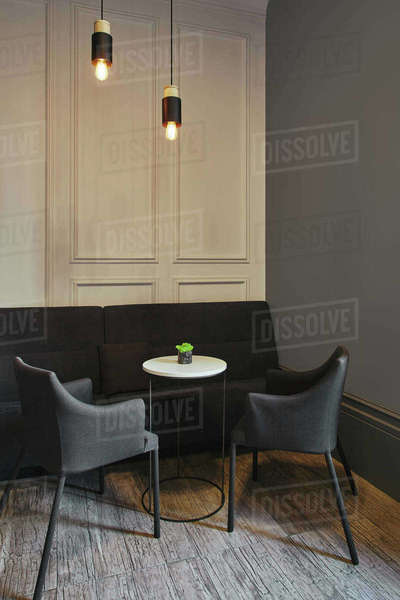 Modern cafe interior with comfortable furniture and illuminated light ...