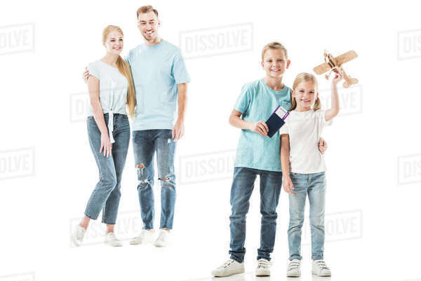 Happy parents looking at kids and smiling isolated on white - Royalty ...