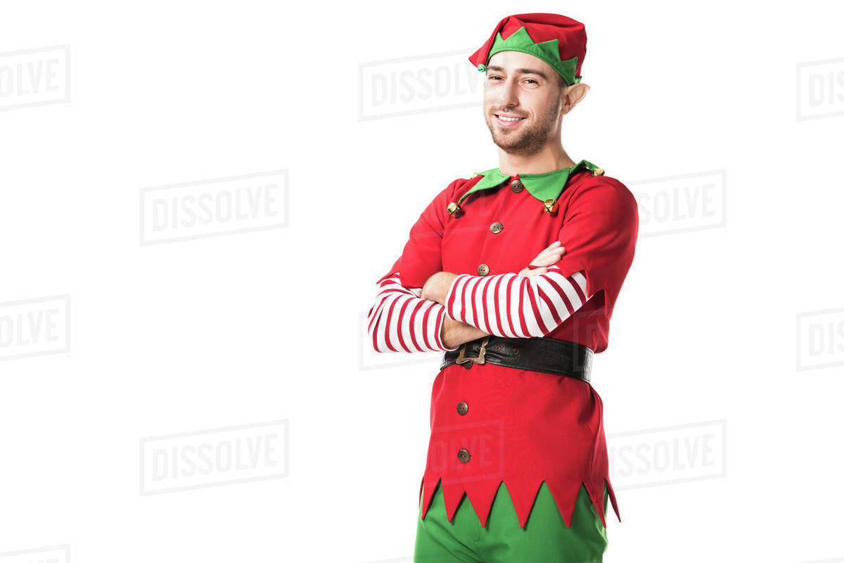 man in christmas elf costume with arms crossed looking at camera ...