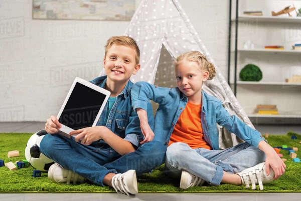 happy little kids showing digital tablet with blank screen near tent at ...