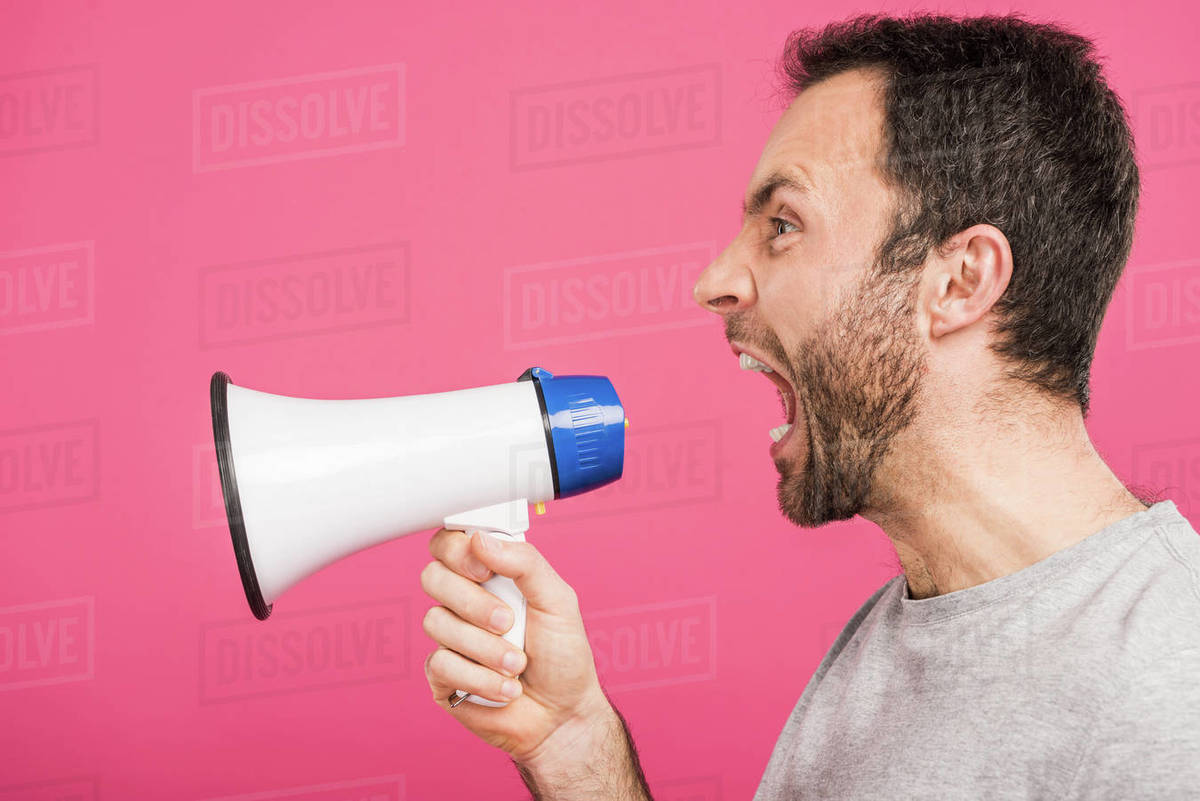 Angry man yelling with megaphone, isolated on pink - Royalty-free Stock ...