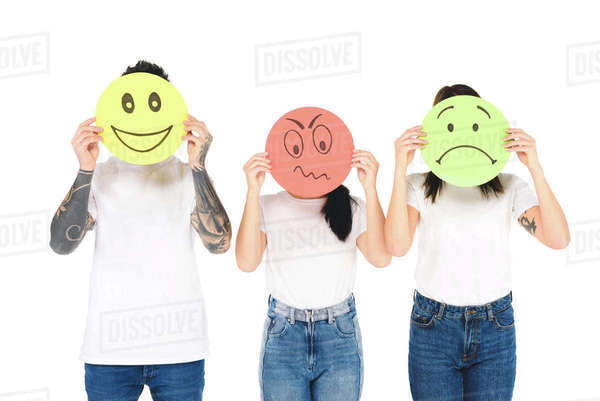 Group of young people holding round cards with different face ...