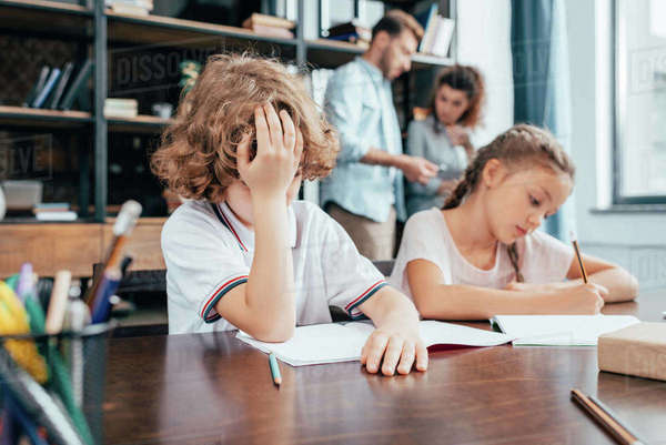 Exhausted little kids doing homework together - Royalty-free Stock ...