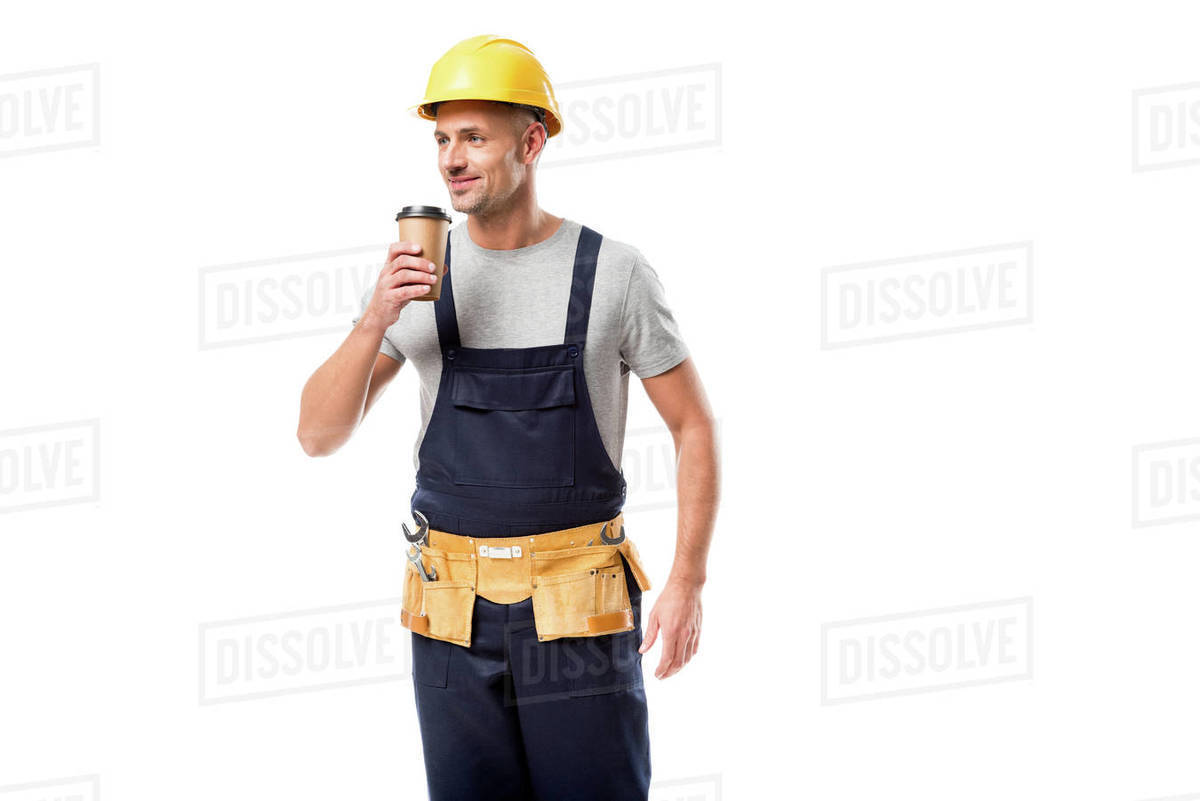 Construction worker in helmet drinking coffee to go isolated on white ...