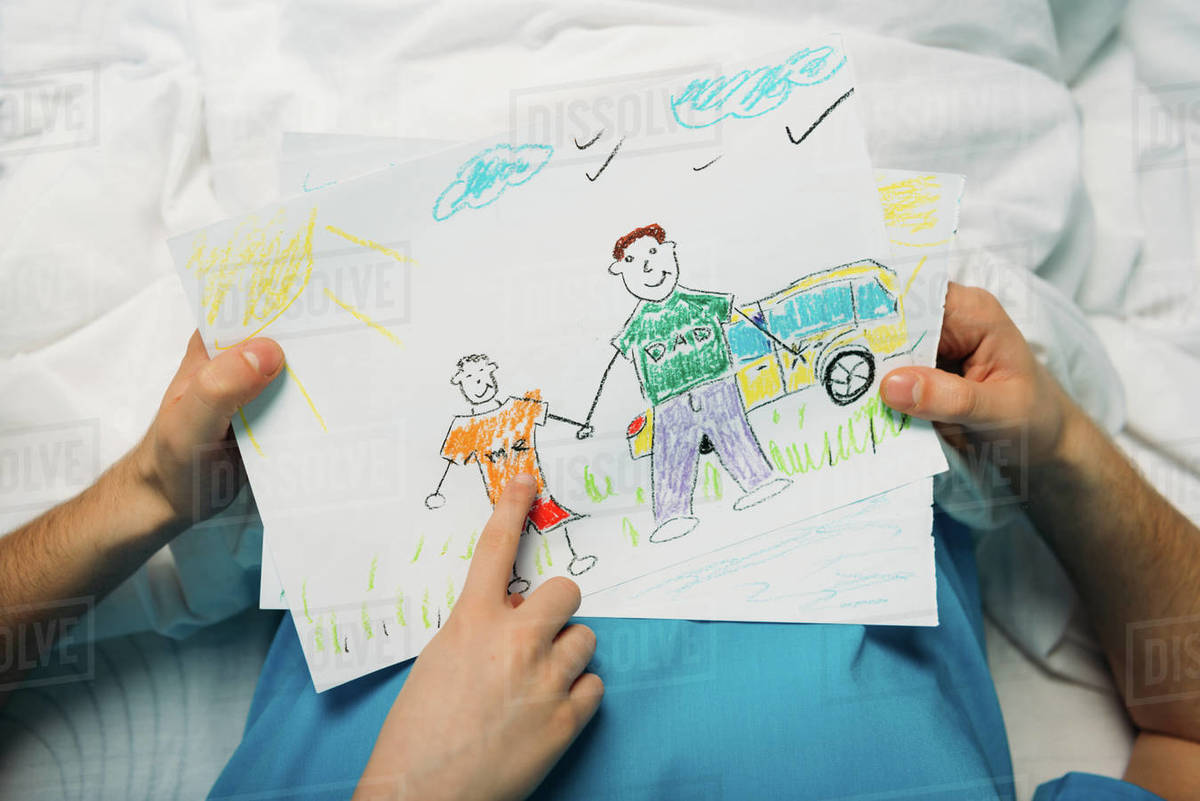 Little son showing sick father his drawings at ward, dad and son ...