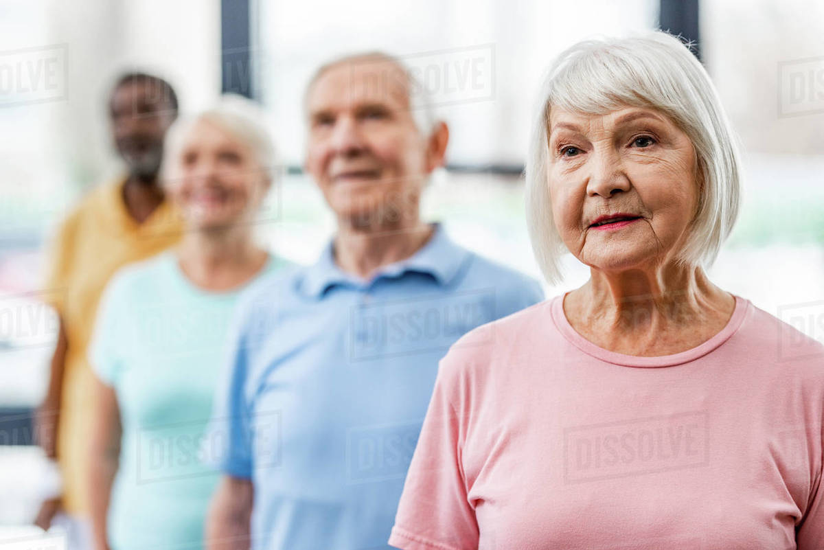 Multicultural senior sportspeople sanding at gym - Royalty-free Stock ...