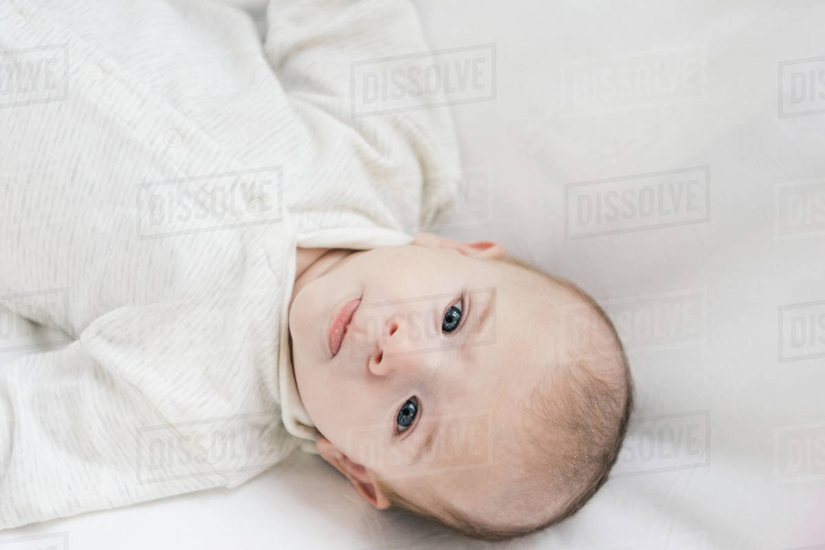 Overhead view of adorable baby looking at camera - Royalty-free Stock ...
