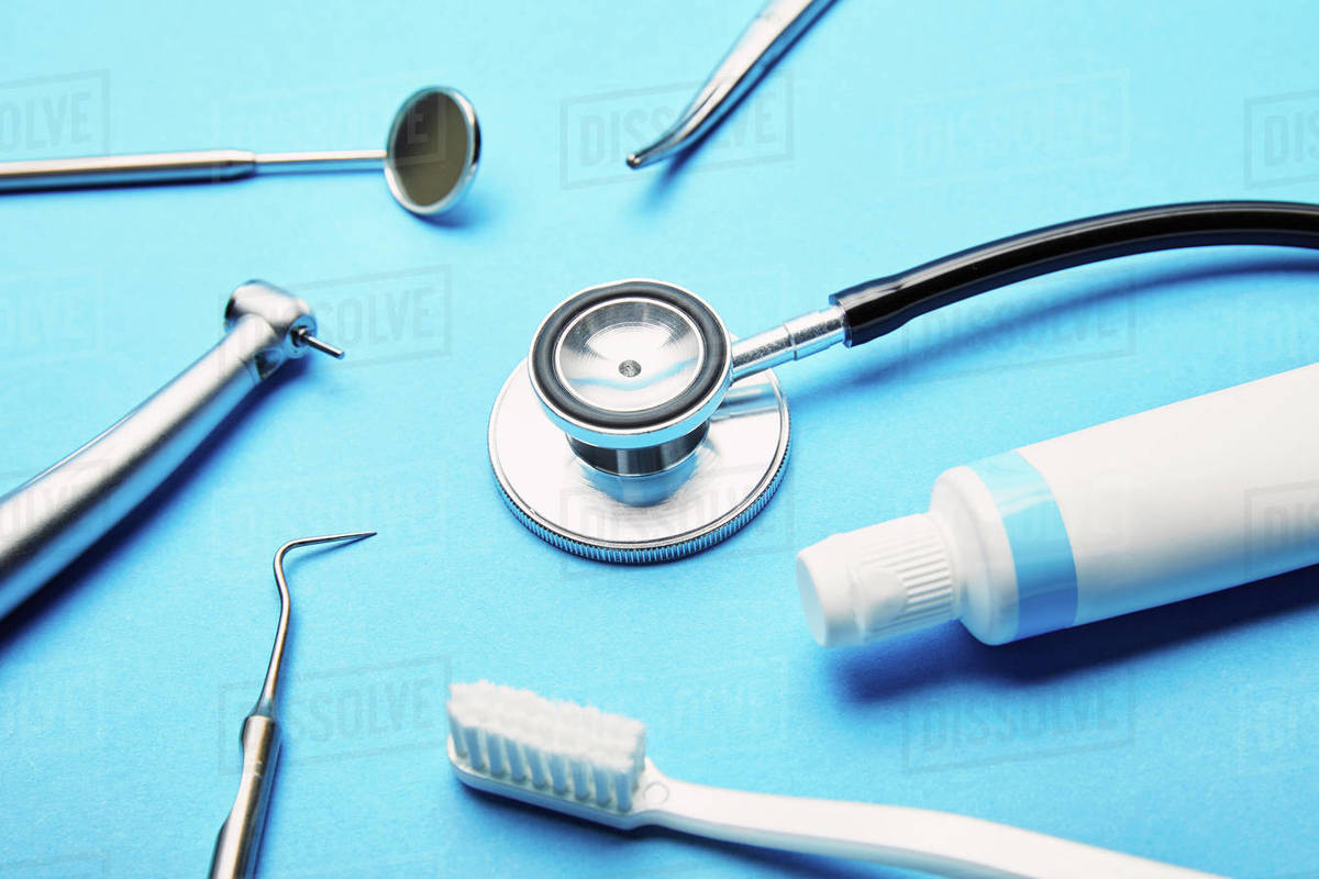 Close up view of arrangement of sterile dental instruments, stethoscope ...