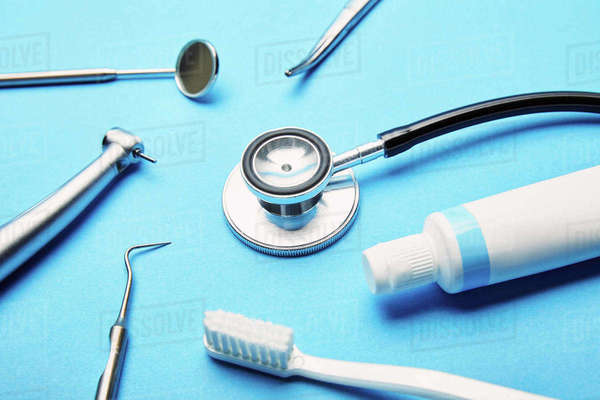 Close up view of arrangement of sterile dental instruments, stethoscope ...