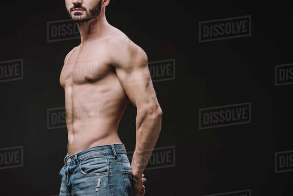 Cropped view of sexy shirtless macho posing isolated on black - Royalty ...