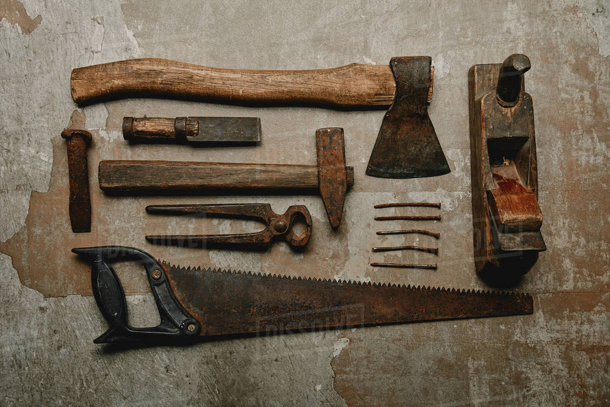 Top view of various rusty carpentry tools on old background - Stock ...