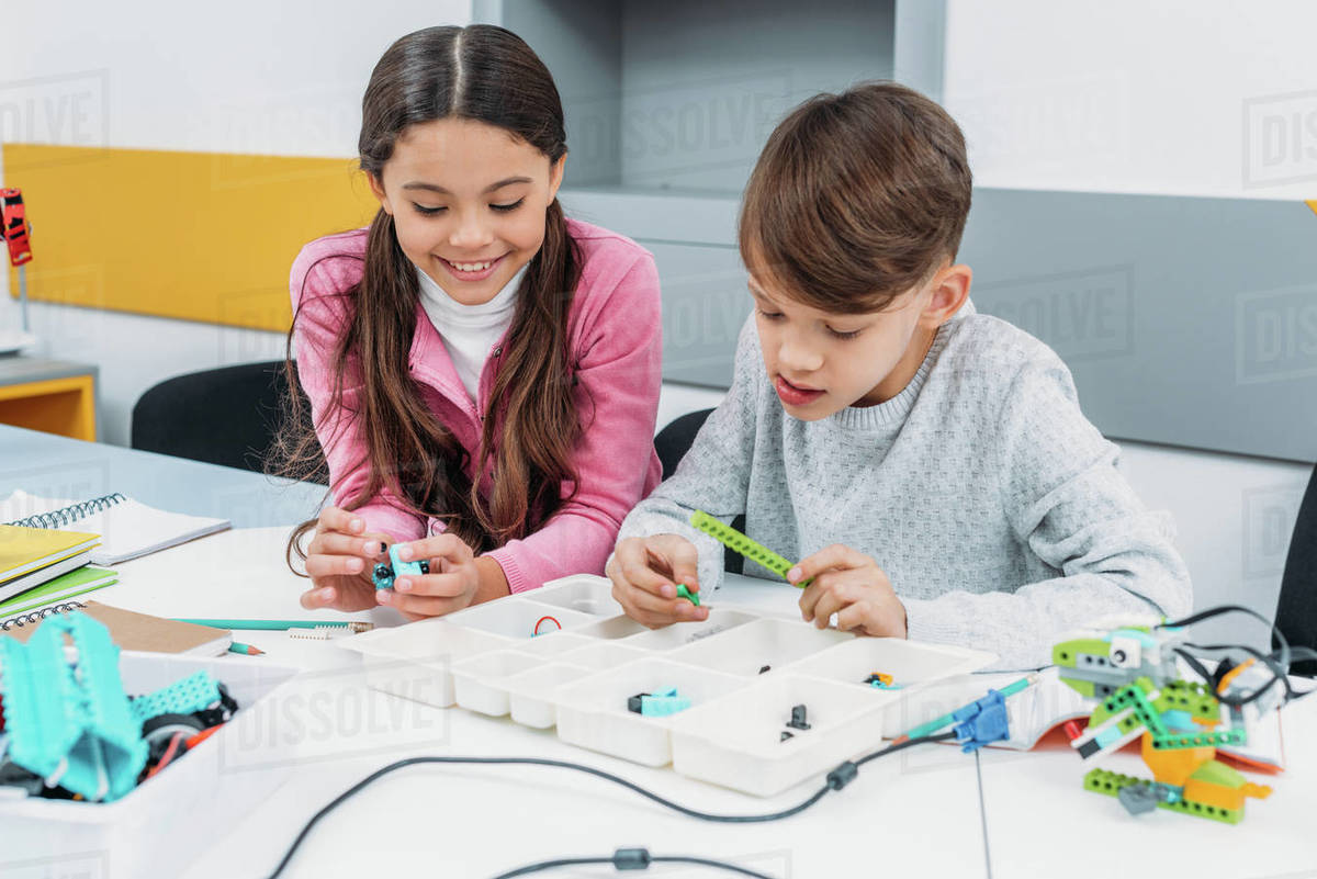 Schoolchildren working on robot at stem robotics lesson - Royalty-free ...