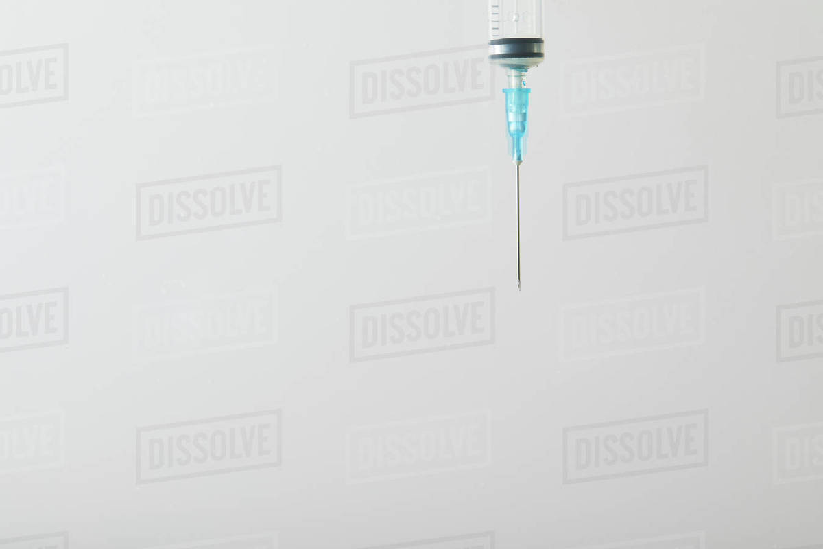 Close up of syringe for injection isolated on grey with copy space ...