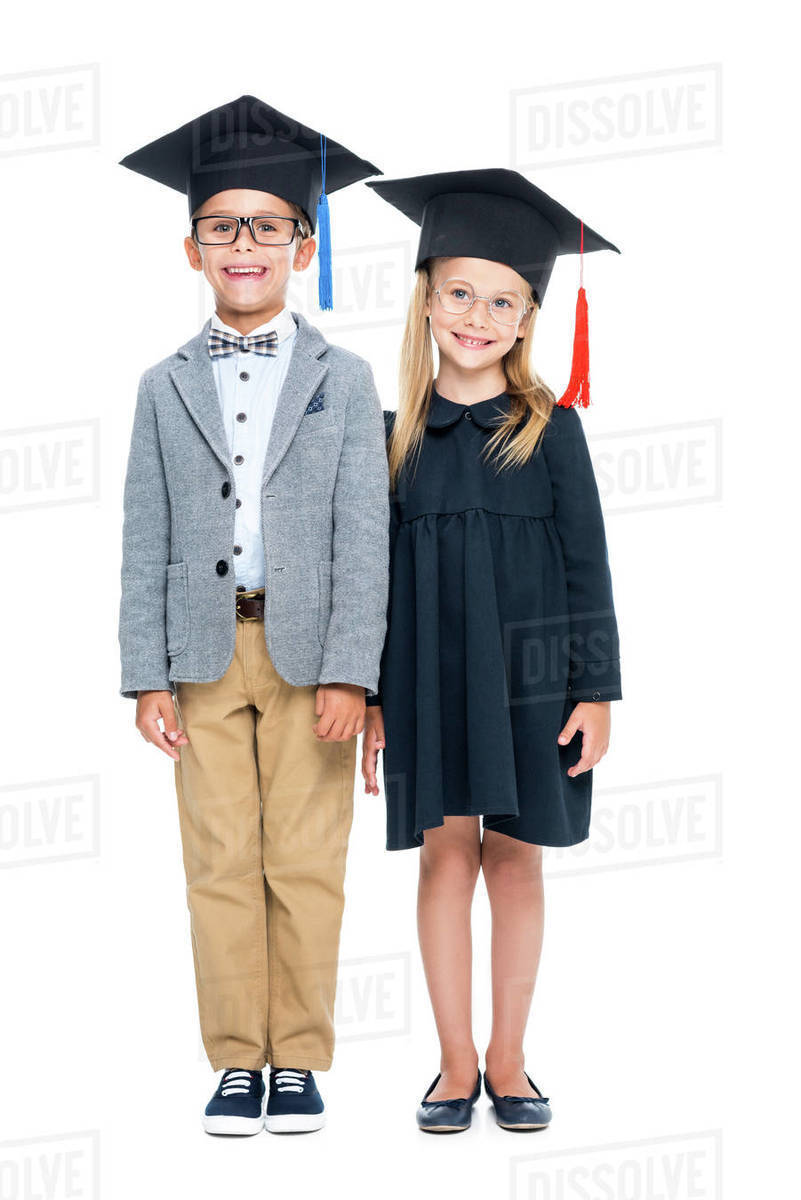 Adorable pupils in graduation hats isolated on white - Royalty-free ...