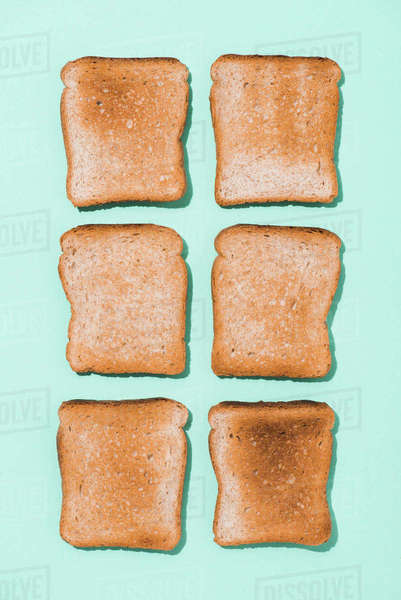 Top view of assembled crispy toasts on blue surface - Stock Photo ...