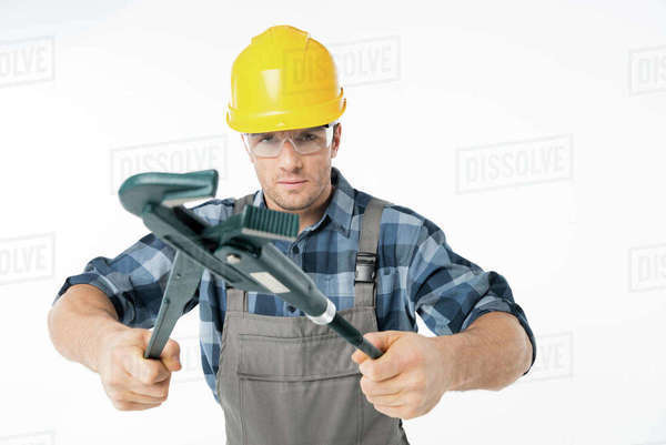 Professional male construction worker in helmet and protective eyewear ...